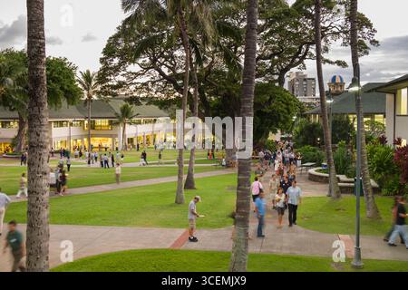 Adults walking on the campus of Punahou High School a private college ...