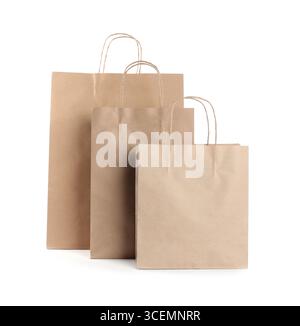 Three kraft paper bags isolated on white Stock Photo - Alamy