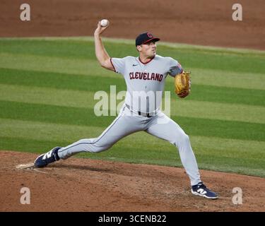 Cleveland Guardians relief pitcher Cade Smith, right, is congratulated ...