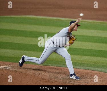 Cleveland Guardians relief pitcher Cade Smith, foreground, looks to ...