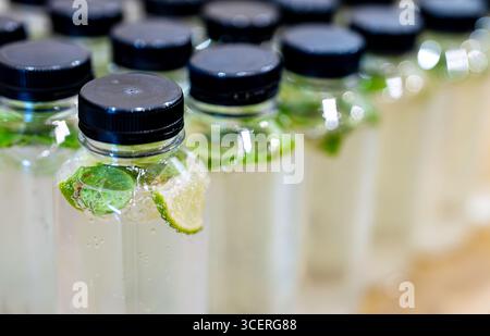 Plastic bottles filled with sparkling lime mint water Stock Photo - Alamy
