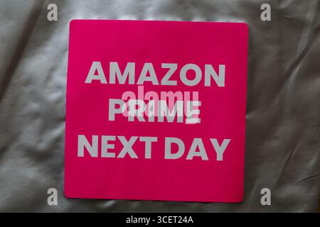 Amazon Prime Next Day pink sticker stuck on Amazon package parcel box ...