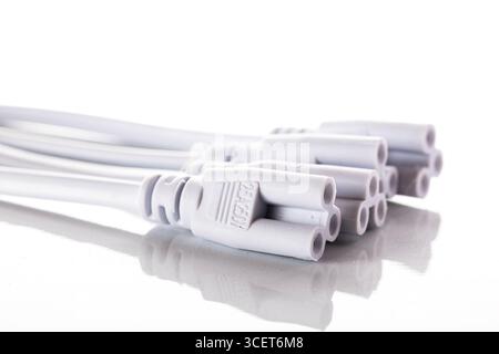 White plastic connectors arranged in circle on wooden surface Stock ...