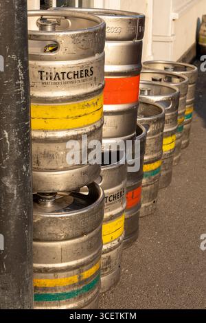 Metal beer kegs stacked outside of a pub Stock Photo - Alamy