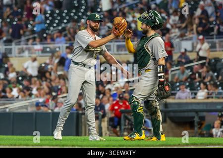 Athletics pitcher Hogan Harris (36) looks at the crowd after winning a ...