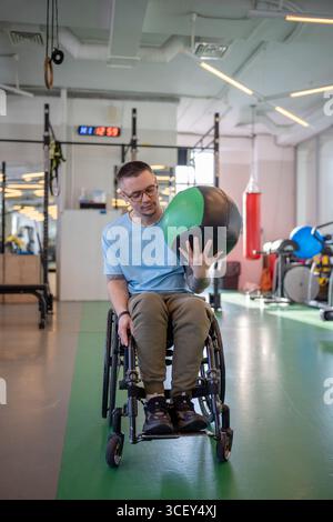 An athletic man performs exercises on the bars - Mid shot Stock Photo ...