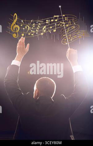 Hands of conductor and music note symbols on dark background Stock ...