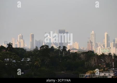 The Panama Canal: the high-rise towers of Panama City appearing above ...