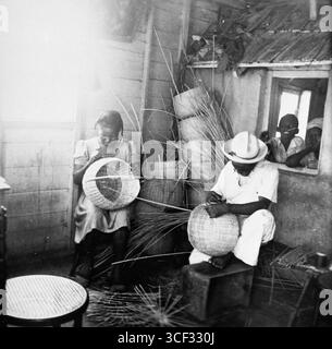 A photograph from 1900 showing a man and woman dressed in traditional ...