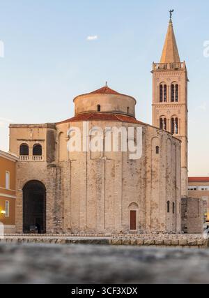 Catholic church of St Anastasia with bell tower, and water well in ...