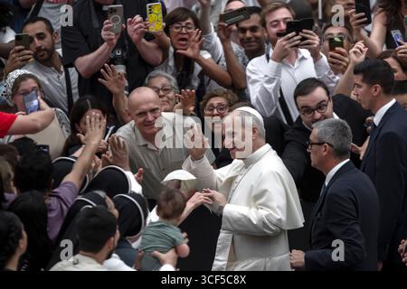 Pope Leo XIV greets the faithful during his weekly general audience in ...