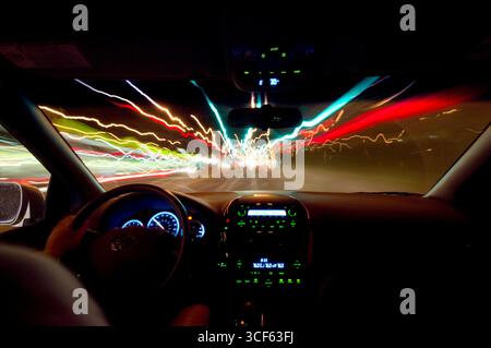 Toyota Sienna Minivan driving at night with motion blur of lights along ...