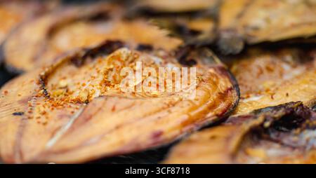 Selection of assorted home made smoked fish on a farmers market in ...