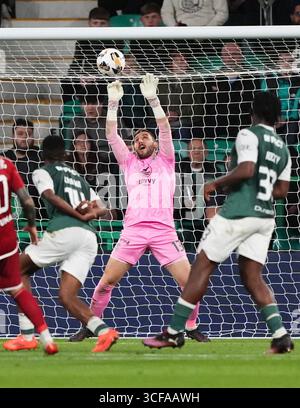 Hibernian goalkeeper Jordan Smith (centre) makes a save during the UEFA ...