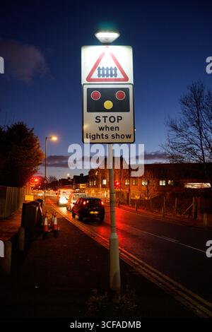 A street "Train warning" sign against the blue sky Stock Photo - Alamy