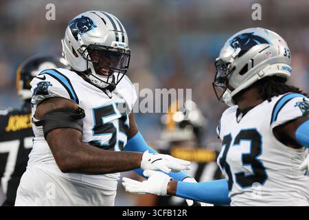 Carolina Panthers linebacker Princely Umanmielen (3) tackles Miami ...