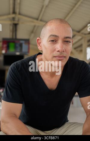 Handsome middle age man waiting for laundry skeptic and nervous ...