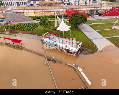 NANNING, CHINA - AUGUST 22, 2025 - The shops along the river at Tingzi ...