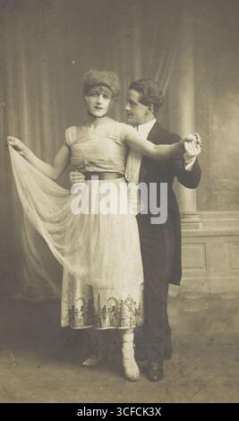 Two men, one in drag, posing as a performing couple. Photograph, 189 ...