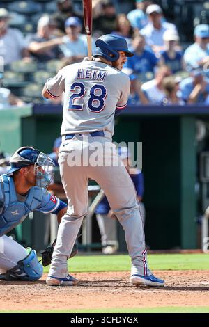 Texas Rangers catcher Jonah Heim pauses behind home plate during the ...