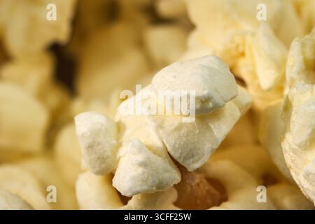 Freshly popped popcorn filling a bowl ready for movie night or a snack ...