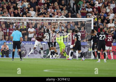 Joao Pedro of Chelsea shoots at goal, blocked by Nathan Collins of ...