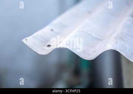 Close-up of the wavy aluminum metal surface background in purple, ultra ...