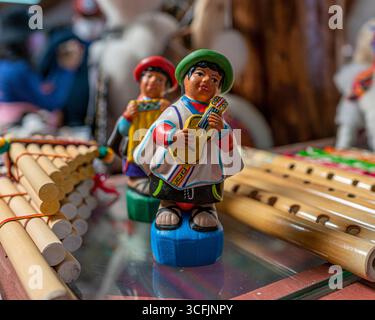 Colorful clay figurines representing traditional architecture and ...
