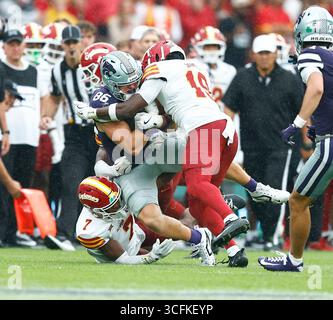 Kansas State tight end Garrett Oakley puts his hand to his ear after ...