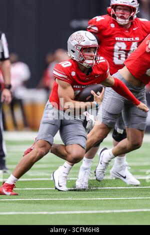 UNLV quarterback Anthony Colandrea (10) scores a touchdown in front of ...