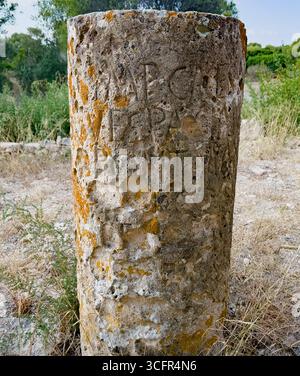 Archaeological Roman milestone marker carved with Latin letters ...