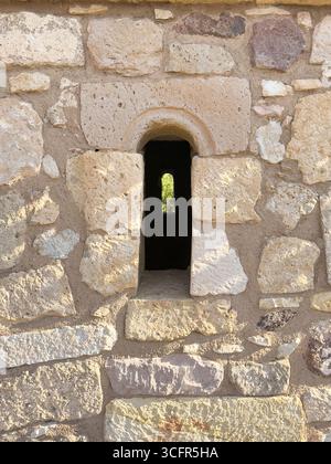 Old small Christian chapel built of stone blocks with tiled roof ...
