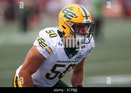 Edmonton Elks' Joel Dublanko (50) and Jared Brinkman (91) take down ...