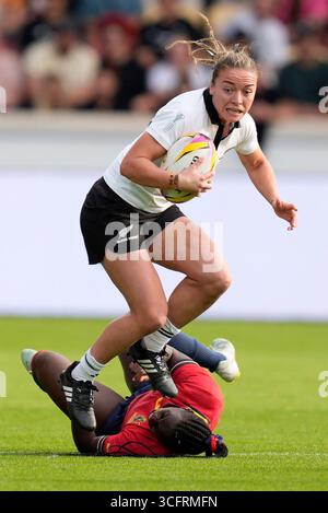 New Zealand's Renee Holmes, right, is tackled by South Africa's Maceala ...