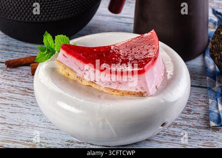 Tasta Raspberry cheesecake dessert served mint Stock Photo - Alamy