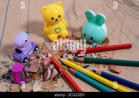 Colorful pencil shavings and a piece of wood Stock Photo - Alamy
