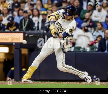 Milwaukee Brewers designated hitter Christian Yelich runs to second ...