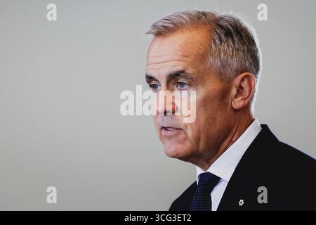 Prime Minister Mark Carney looks on during a cabinet swearing in ...