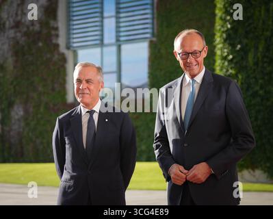 Prime Minister Mark Carney gestures as he listens to questions from ...