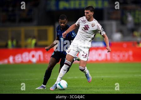 Cesare Casadei of Torino FC competes for the ball with Fabio Miretti of ...