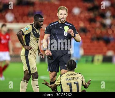 Referee Matt Corlett gives a yellow card to Ar'Jany Martha of Rotherham ...