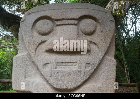 Stone statue with triangular face in San Agustín Archaeological Park ...
