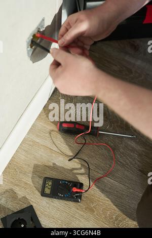 man holding a multimeter Stock Photo - Alamy
