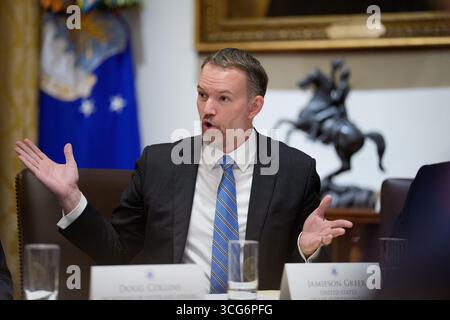 U.S. Trade Representative Jamieson Greer is seen with members of his ...