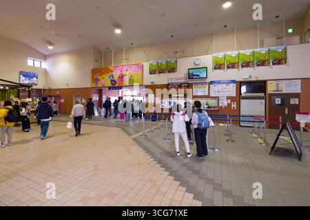 People standing inside Saga Torokko Station, Sagatenryuji ...