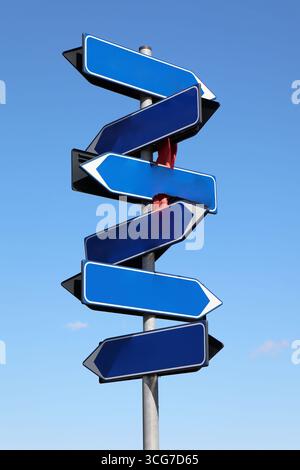 Multiple blank directional signs pointing the left with copy space for ...