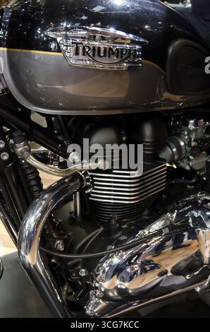 Closeup detailed view black motorcycle engine block with metal oil ...