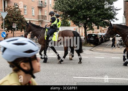 Danish police officers seen on bicycles prior to the CPH Half 2025. 32. ...