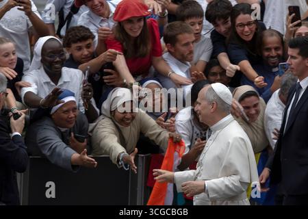 Pope Leo XIV greets the faithful during his weekly general audience in ...