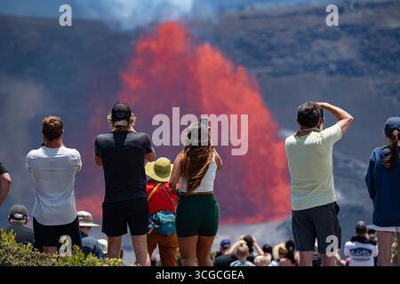 crowds gather to watch lava fountains erupting in the caldera of ...